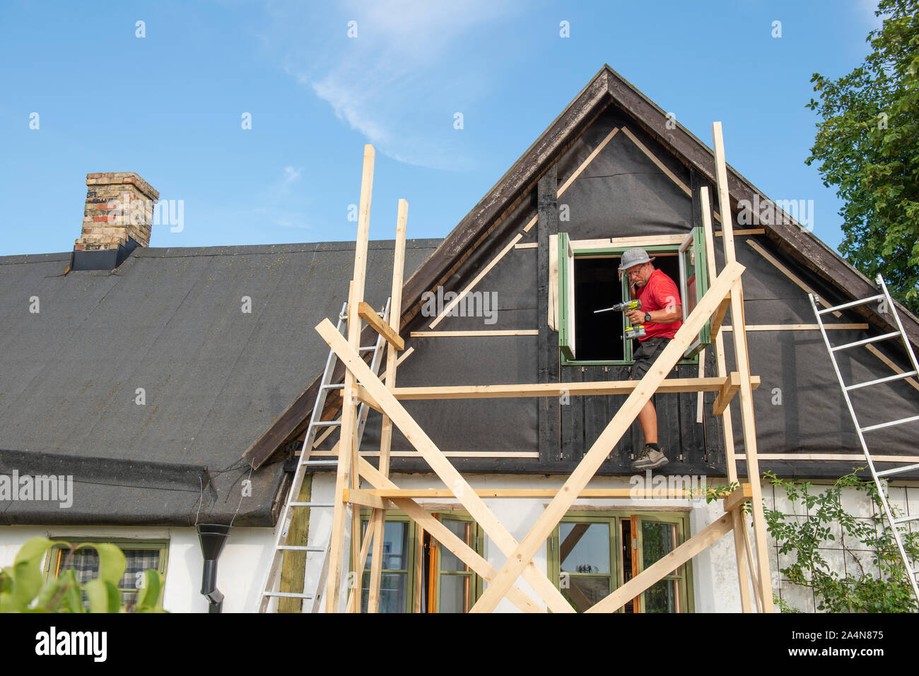 Man renovating house Stock Photo - Alamy