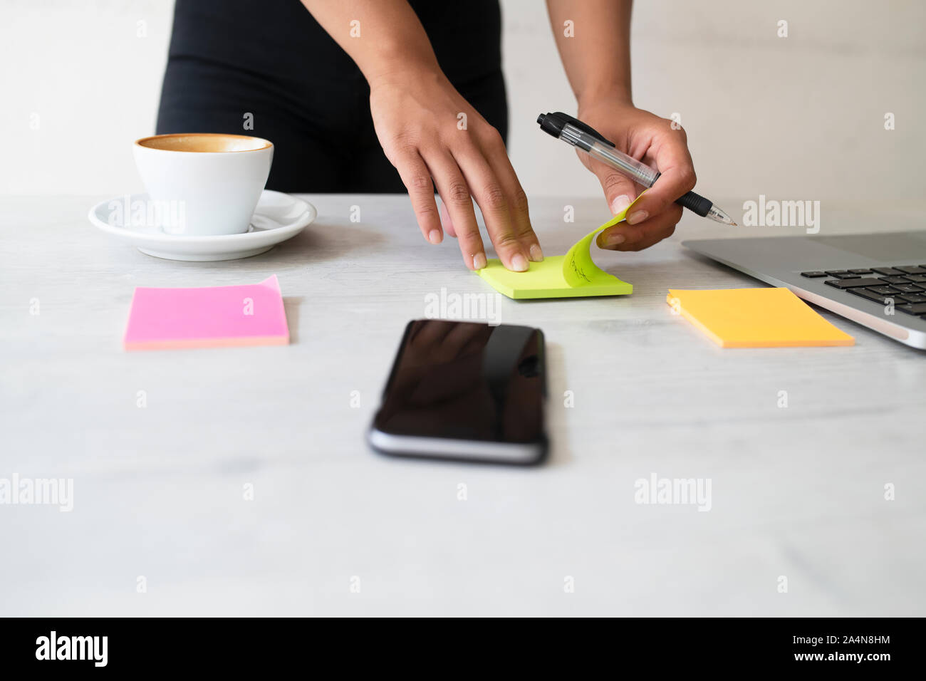 Woman doing notes Stock Photo - Alamy