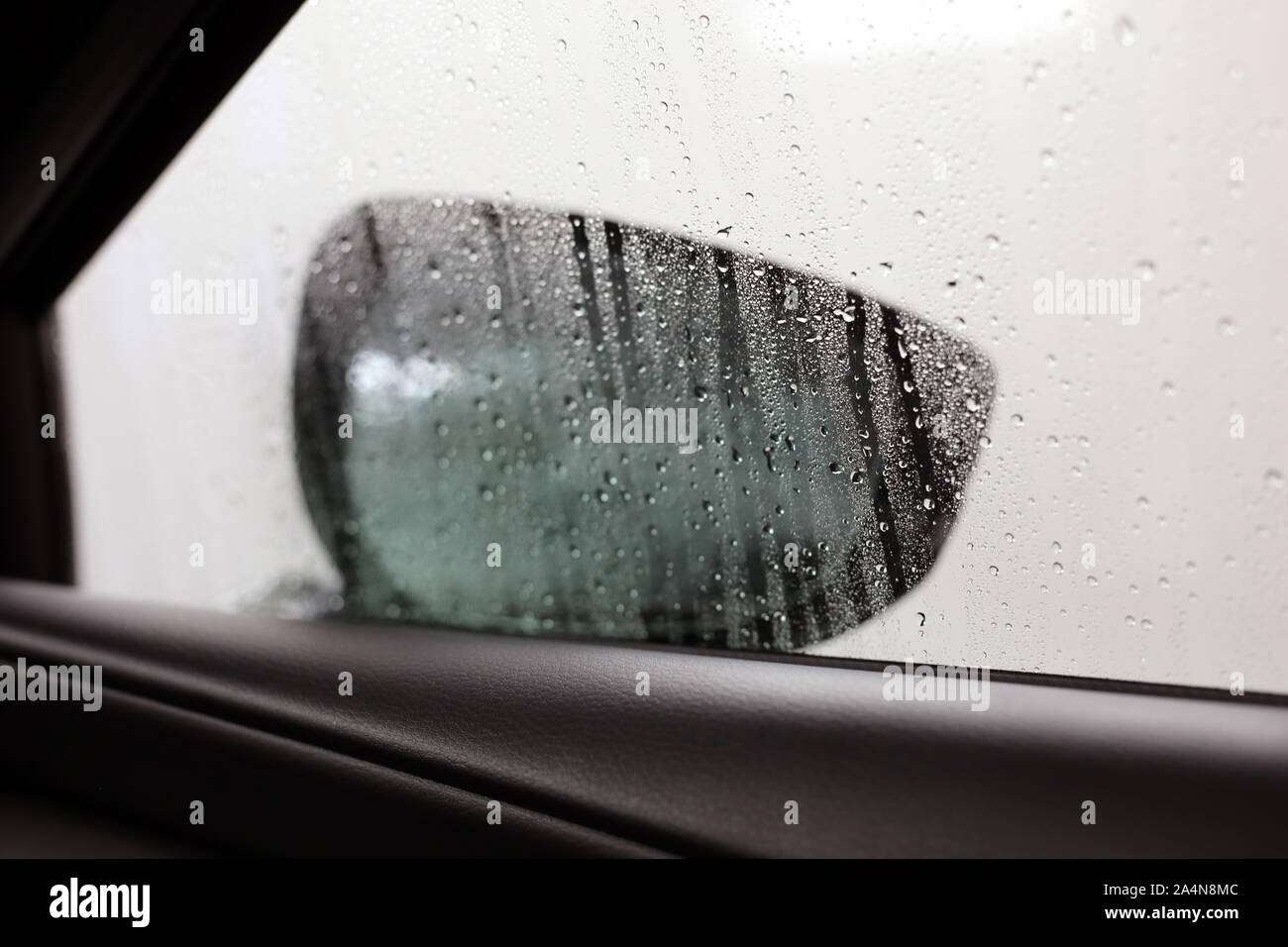 Inside an automatic car wash getting the car cleaned. In this photo you ...