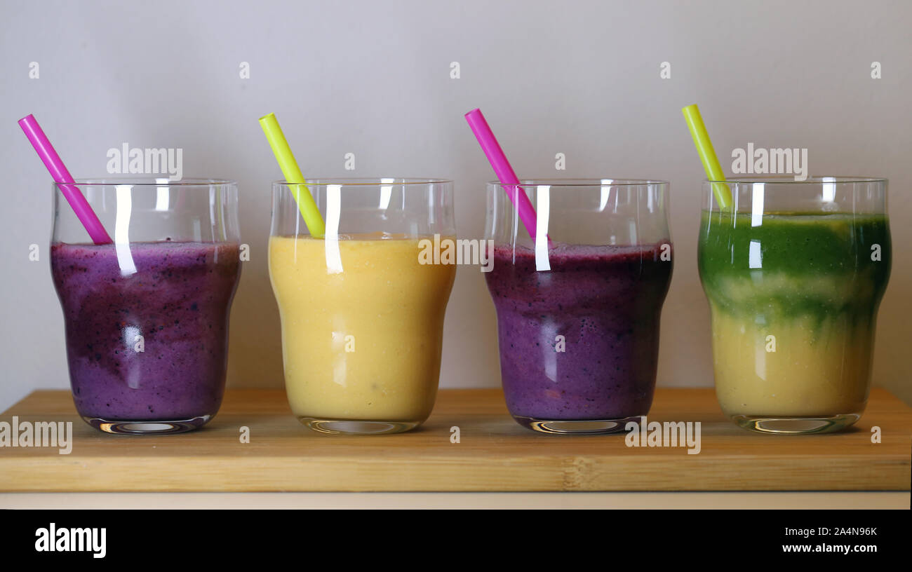 Healthy and delicious homemade smoothie(s) on a table with straws ...