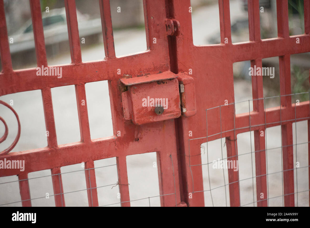 Old red iron gate Stock Photo - Alamy