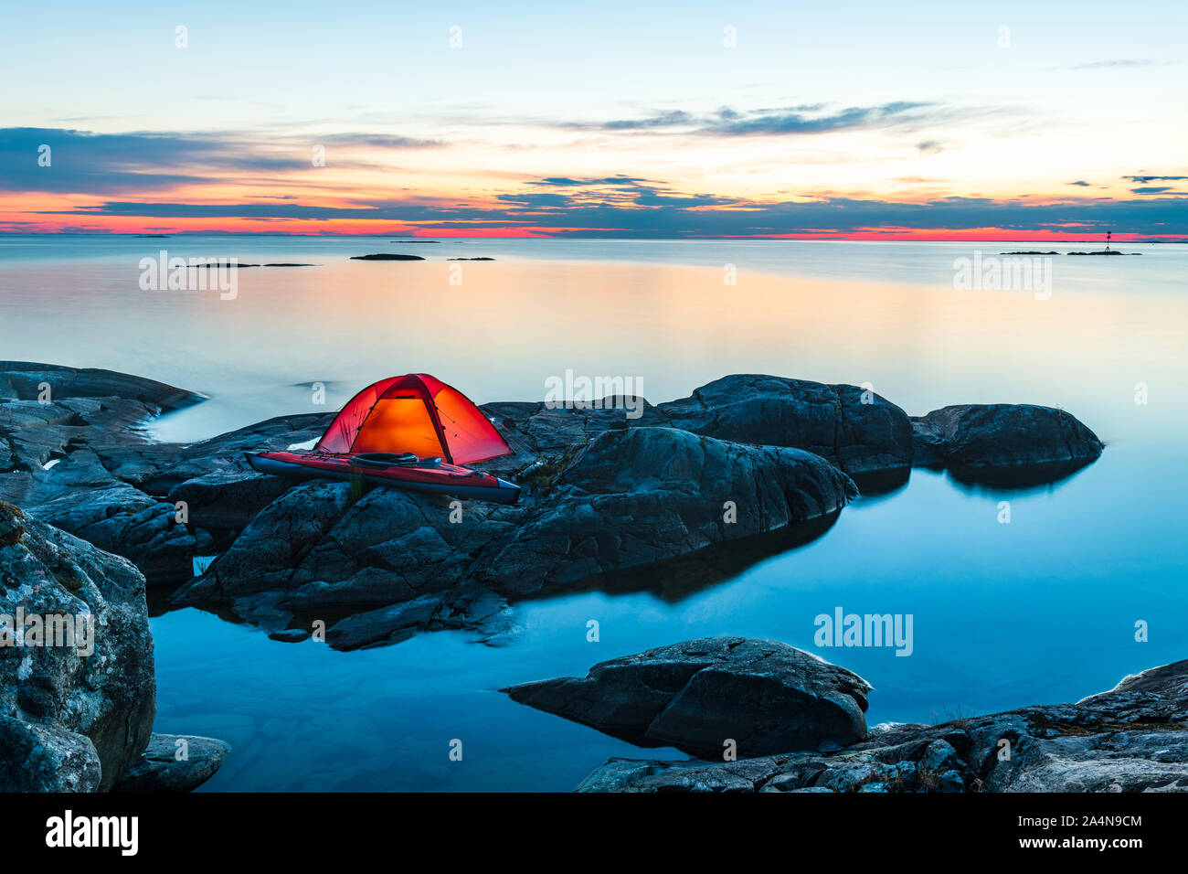 Tent on rocks Stock Photo - Alamy