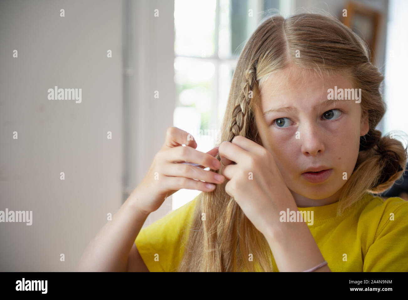Girl braiding hi-res stock photography and images - Alamy
