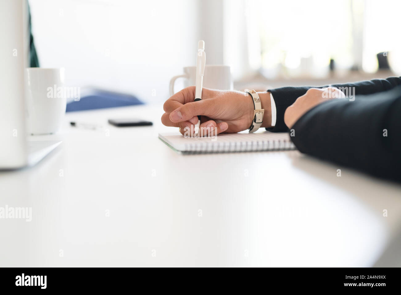 Woman taking notes at business meeting Stock Photo - Alamy