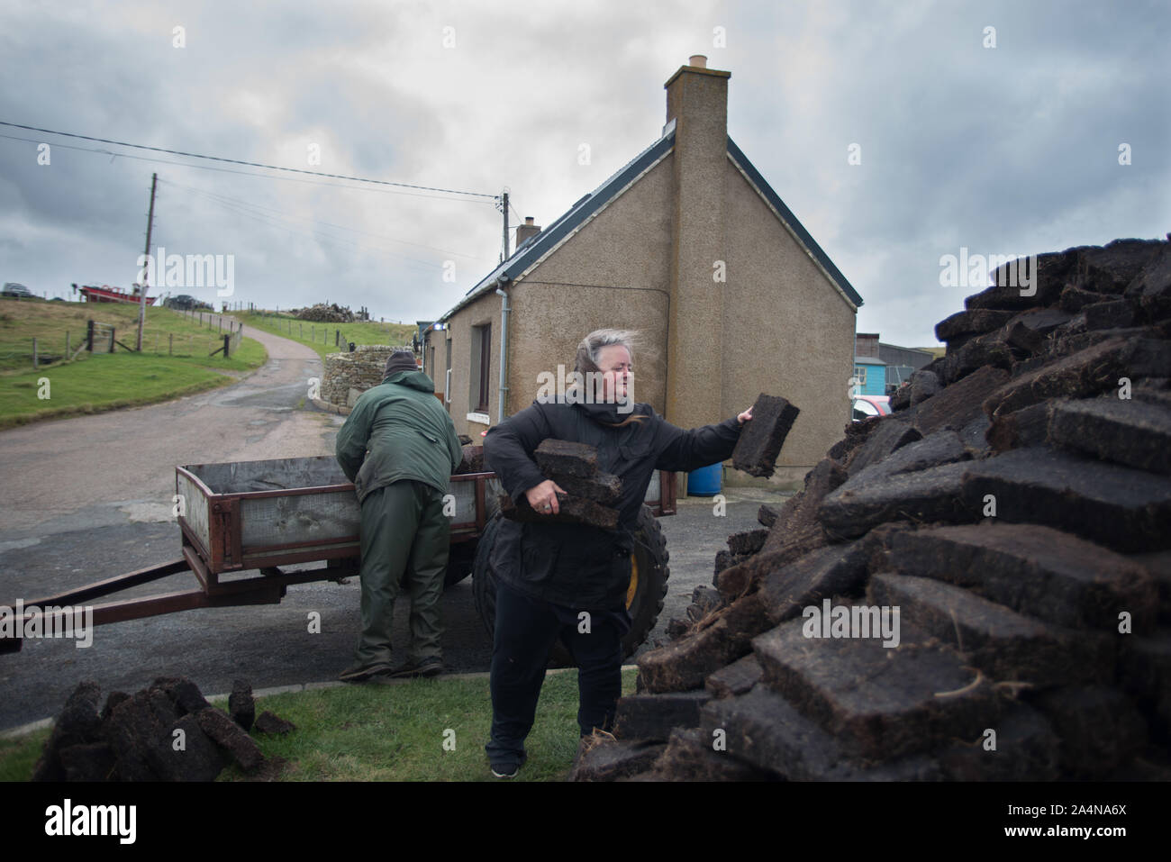 Crofters at Totegan on Strathy Point in Caithness Scotland stack peat ...