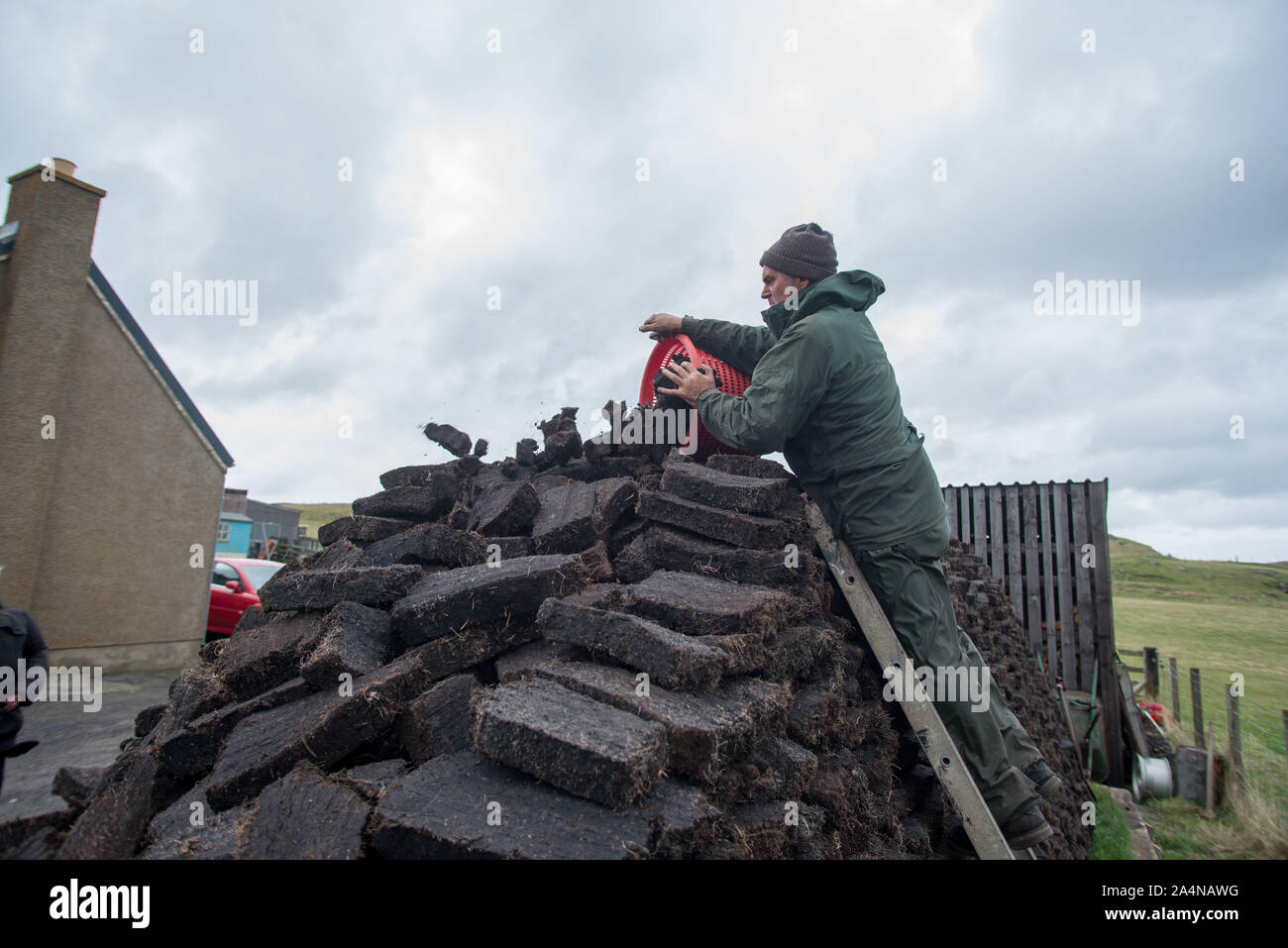 Crofters at Totegan on Strathy Point in Caithness Scotland stack peat ...