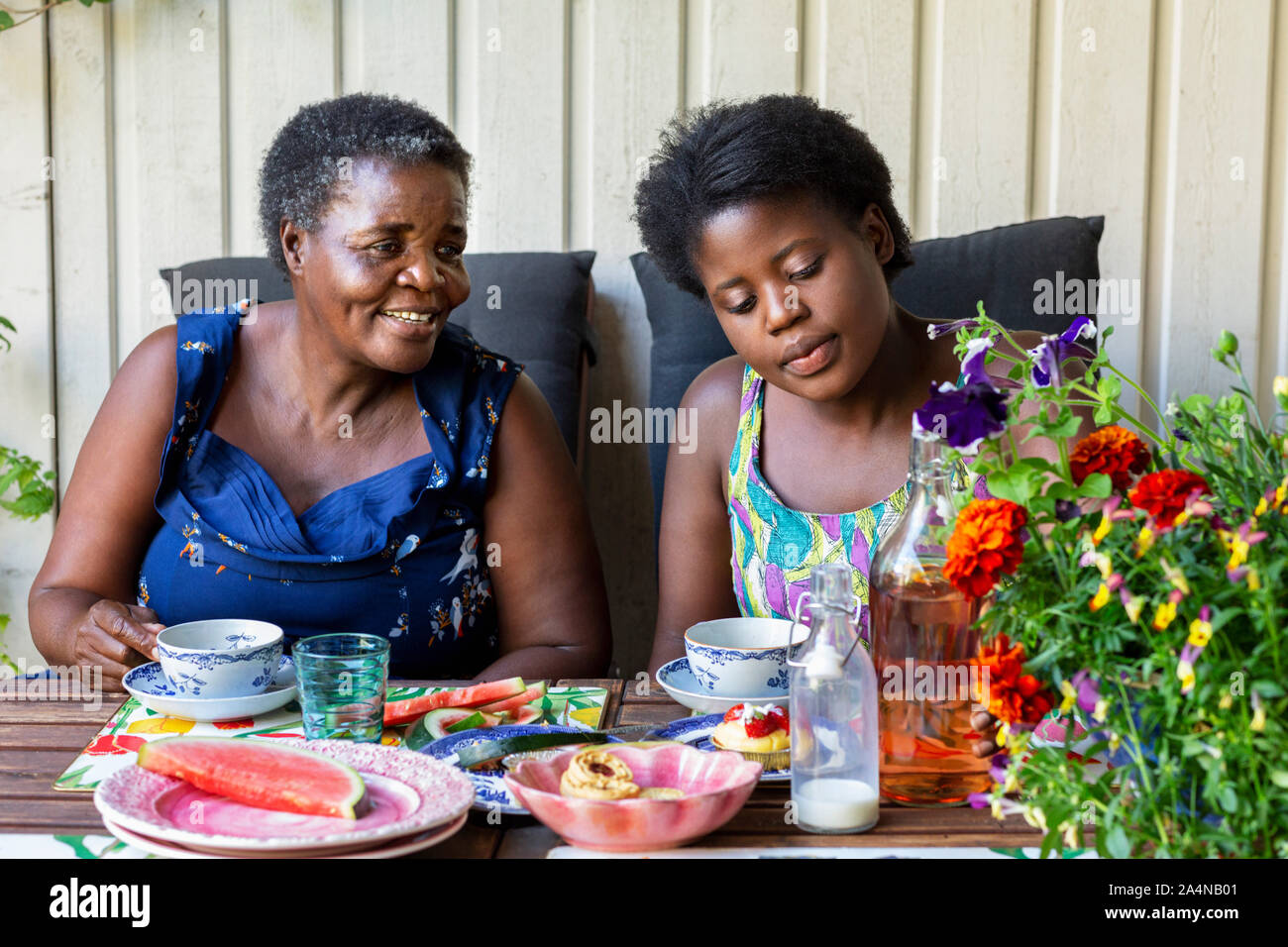 Two women having tea Stock Photo - Alamy
