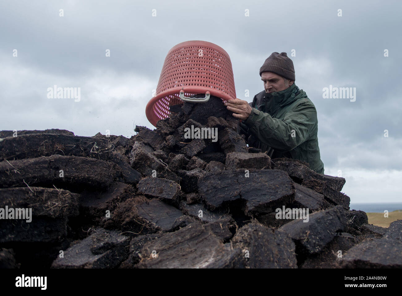 Crofters at Totegan on Strathy Point in Caithness Scotland stack peat ...
