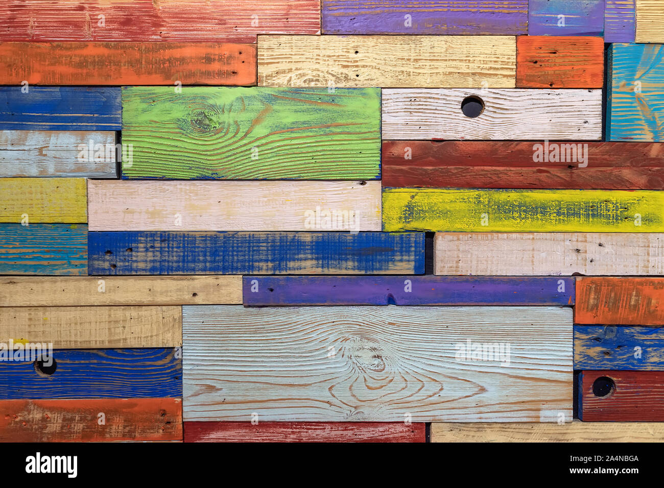 Wall from of horizontal colored painted wooden planks in different ...