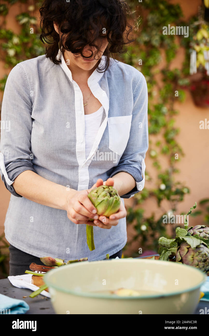 Person putting food in bowl hi-res stock photography and images - Alamy