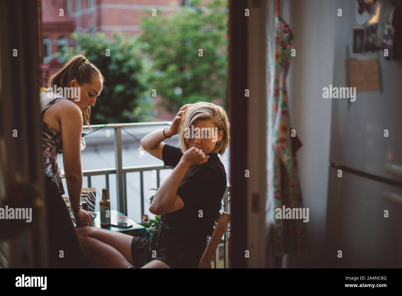 Young friends on balcony Stock Photo - Alamy