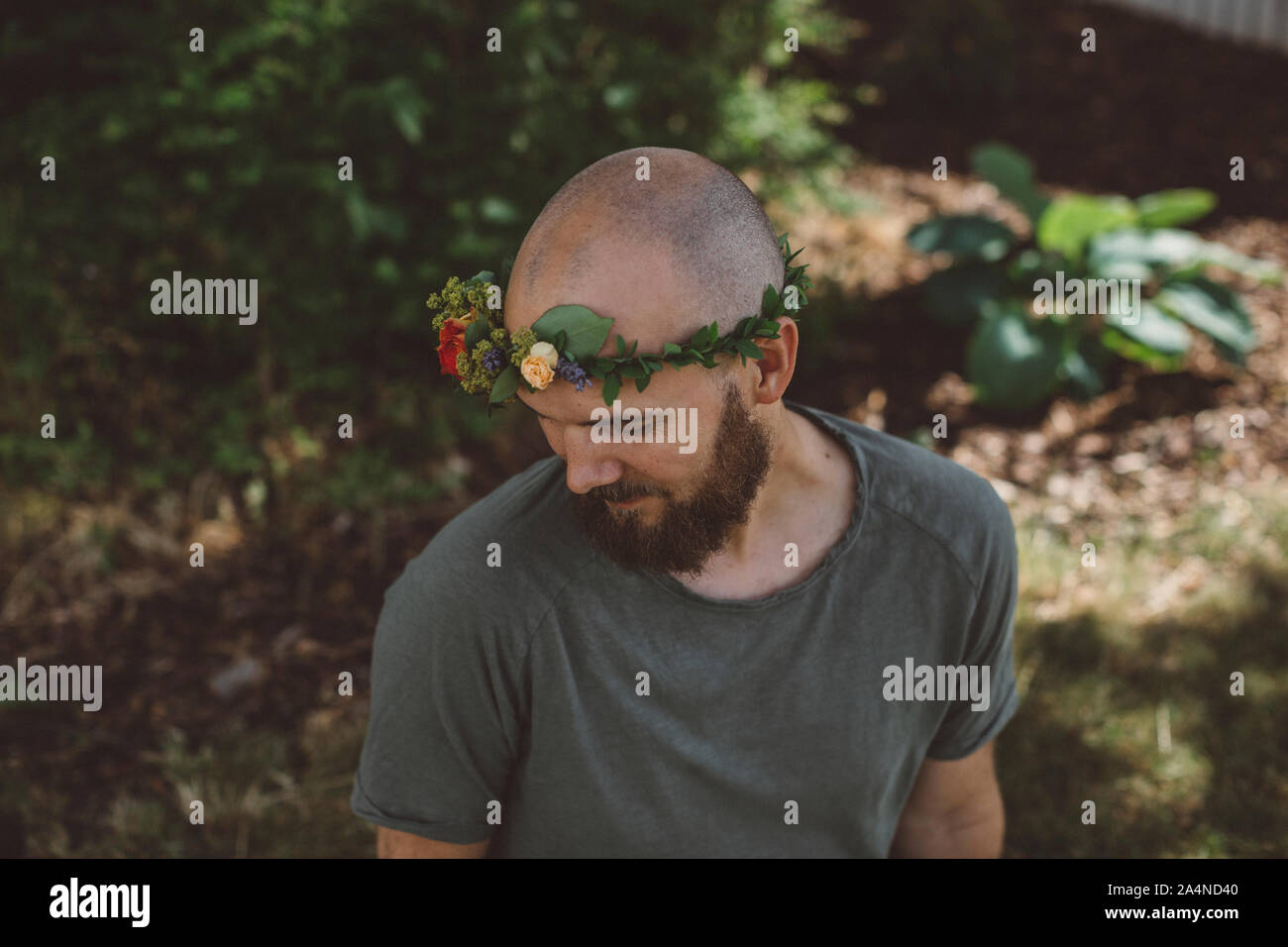Man wearing flower wreath Stock Photo - Alamy