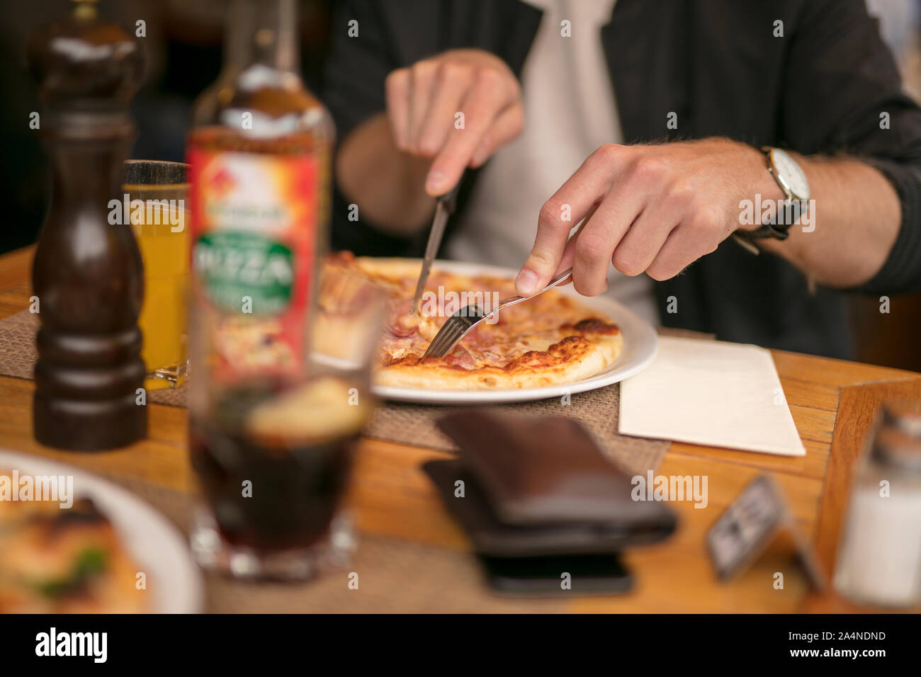 Man eating pizza Stock Photo - Alamy