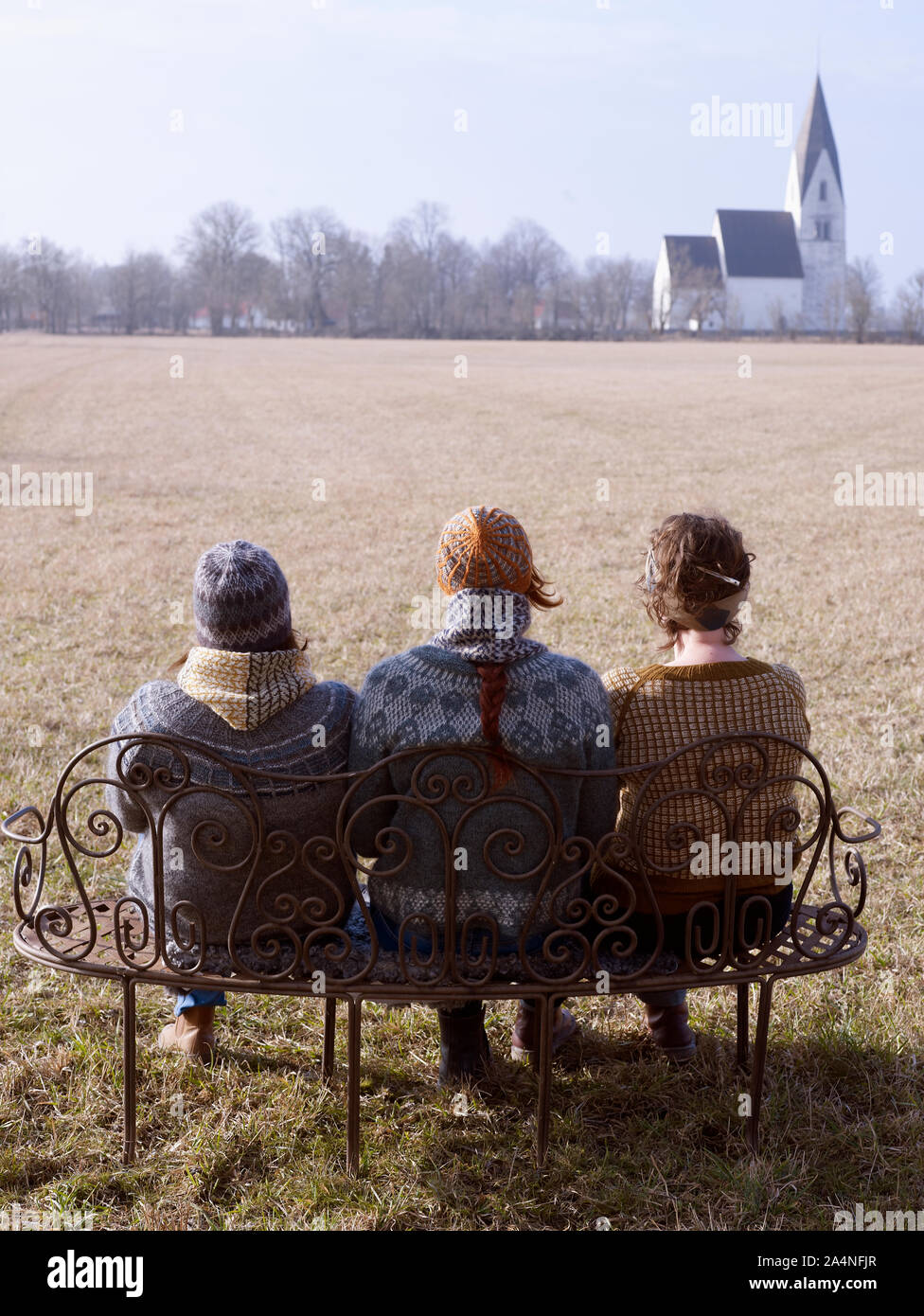 Women sitting on bench Stock Photo - Alamy