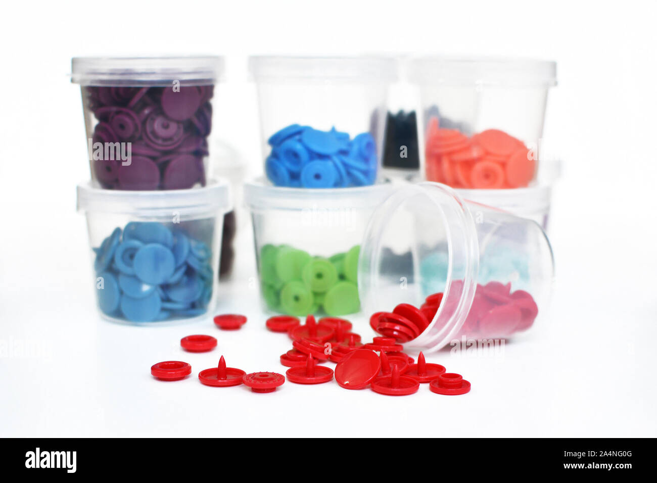 Open transparent plastic container with red plastic snap fastener ...