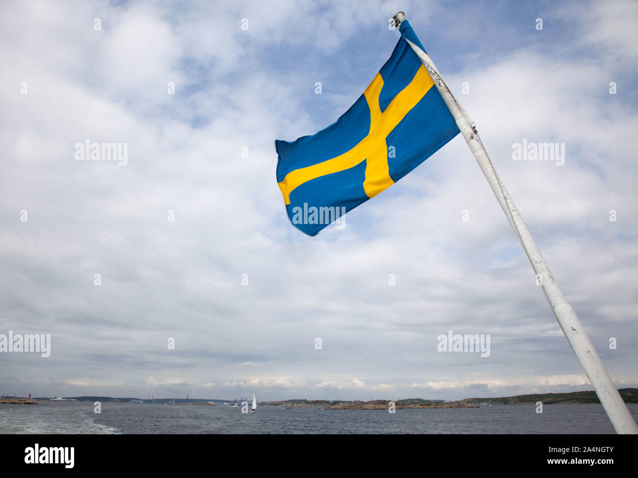 The archipelago of Gothenburg. Swedish flag on a boat.Photo Jeppe ...