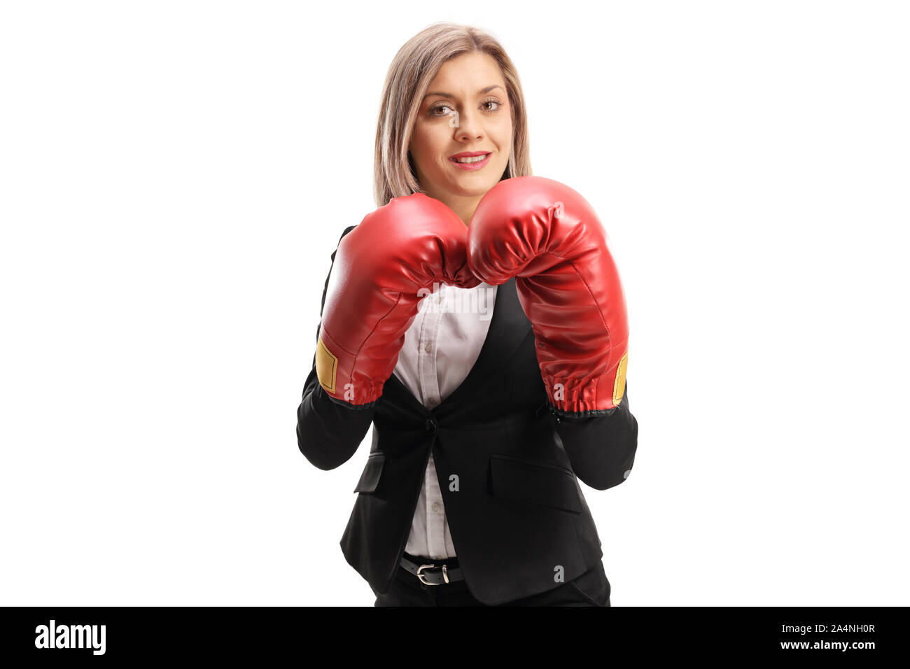 Blond woman in formal clothes wearing red boxing gloves and standing in ...