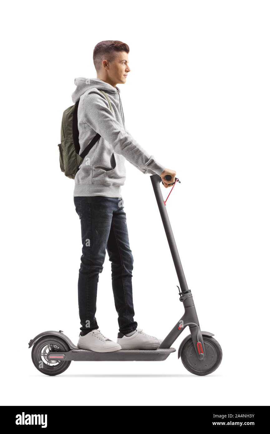 Full length profile shot of a male student with a backpack riding an ...