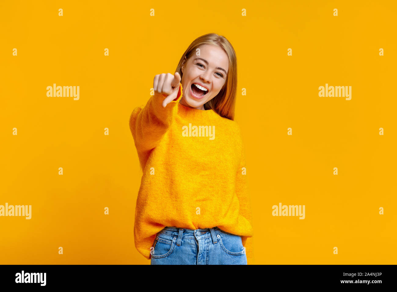 Girl laughing and mocking on somebody, pointing finger at camera Stock ...