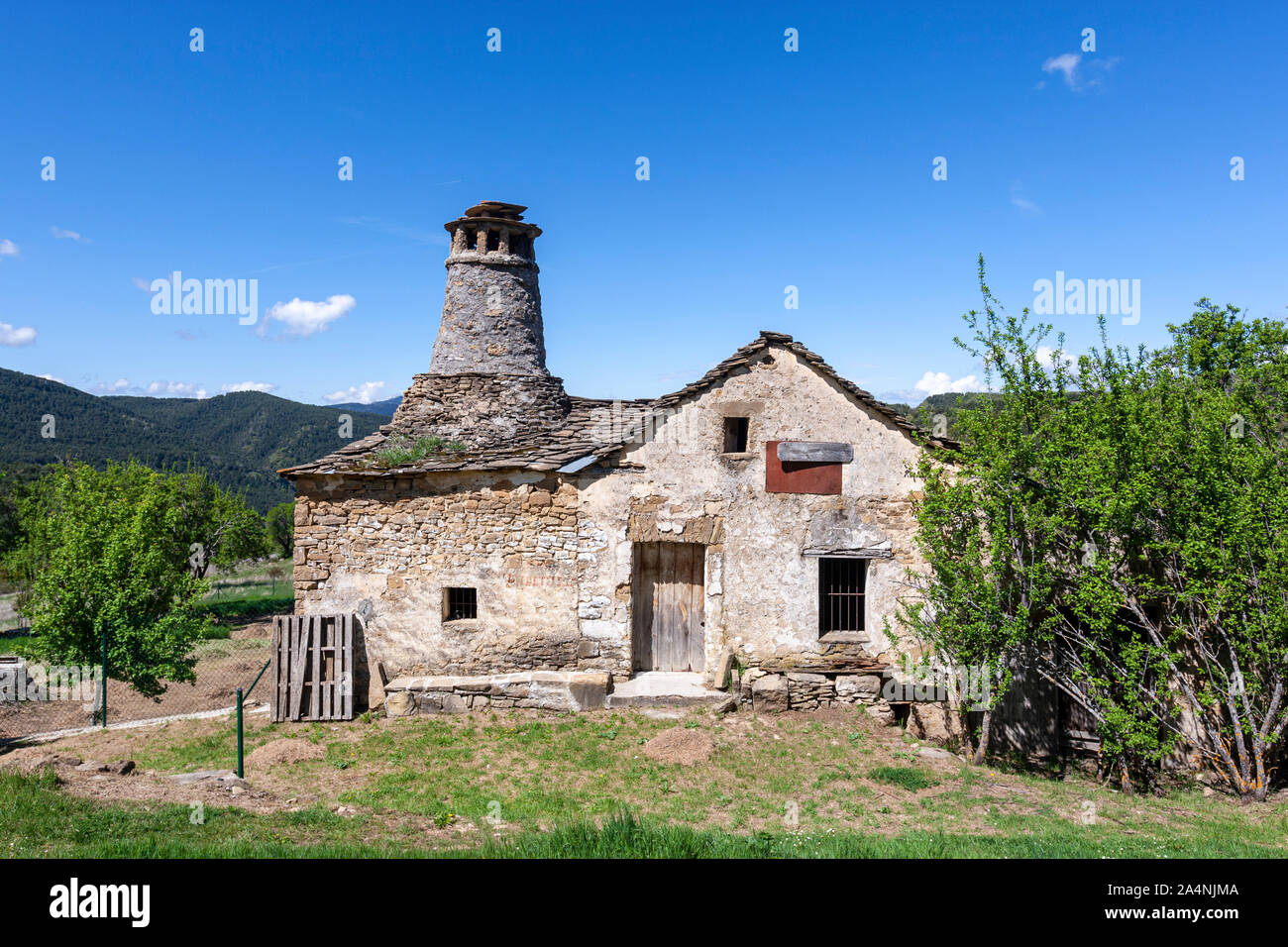 Rural stone house farm with chimney and slate roof near Jaca, Aragon ...