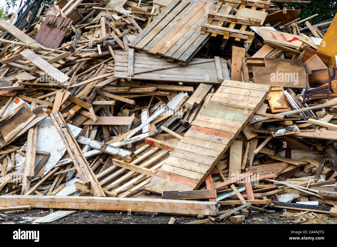 Waste wood, for further processing as firewood, wood chips Stock Photo ...