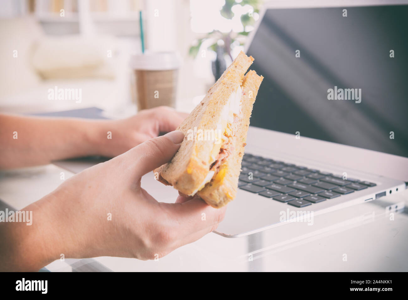 Woman desk snack unhealthy hi-res stock photography and images - Alamy