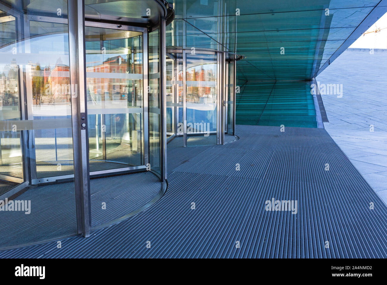 Automatic Revolving Doors at Modern Building Entrance Stock Photo - Alamy