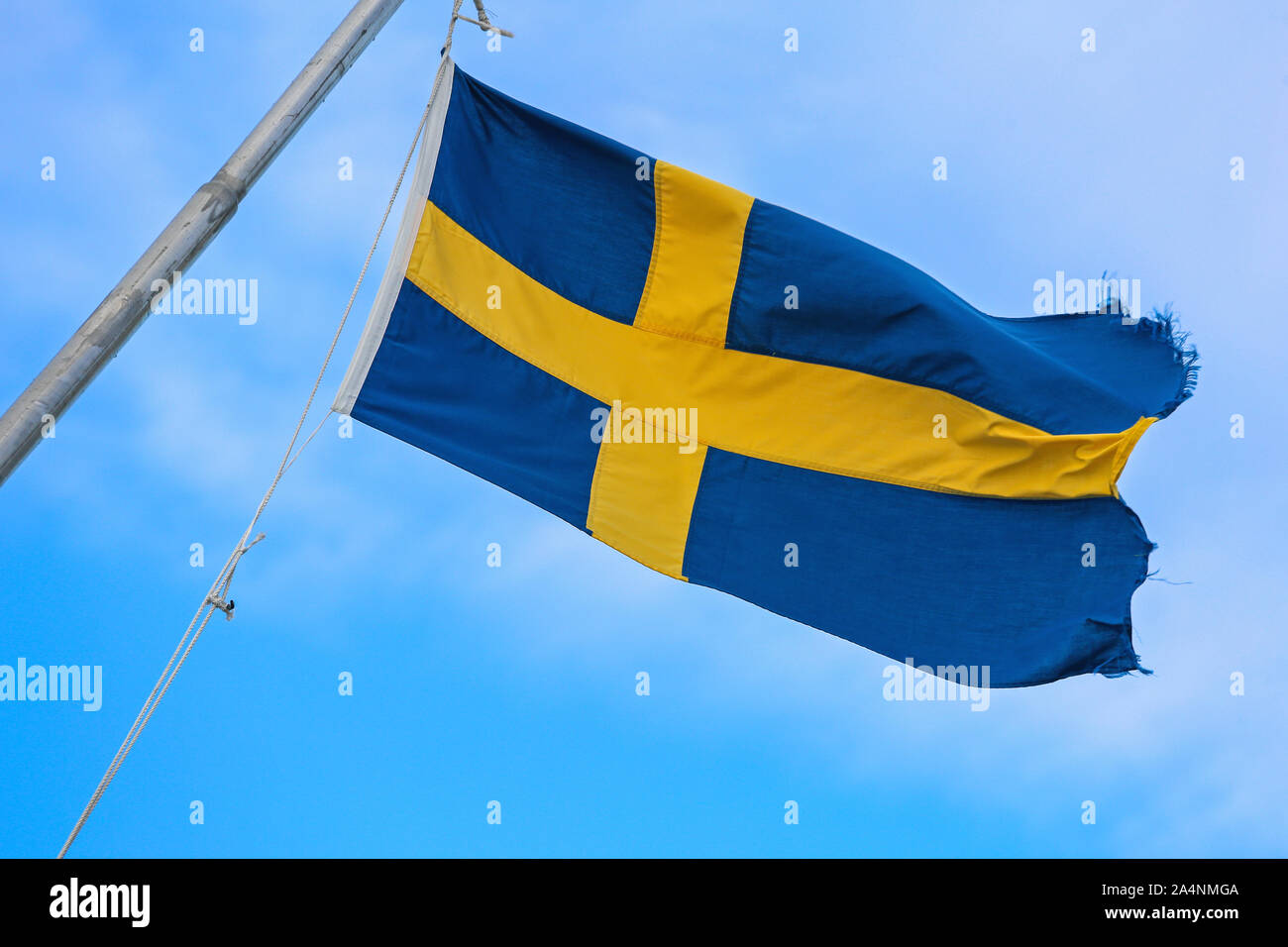 Swedish Flag Yellow Cross Over Blue at Sky Stock Photo - Alamy