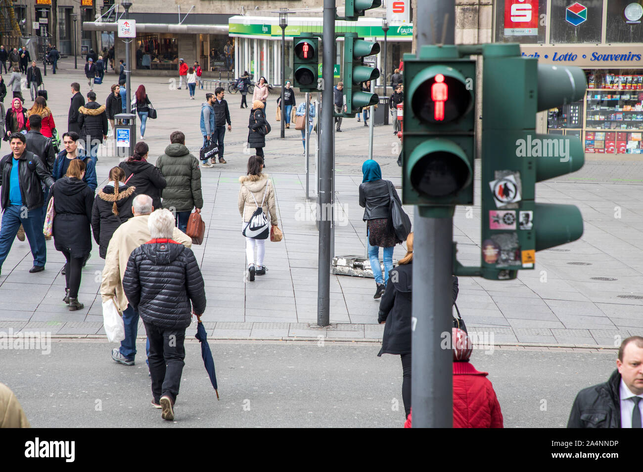 Pedestrian crossing, zebra crossing, pedestrian lights on red, passers ...
