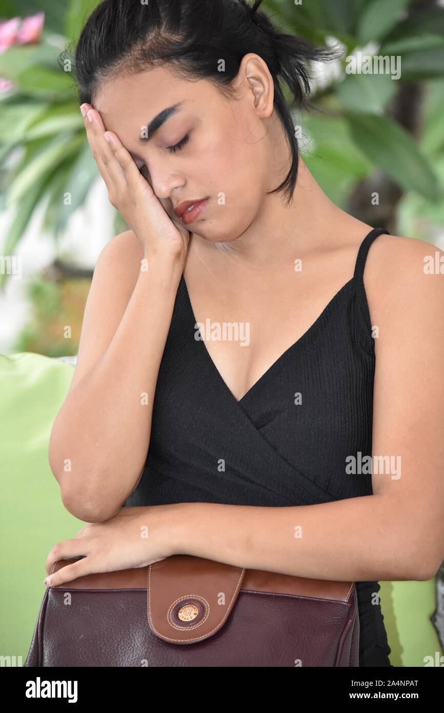 Sleepy Beautiful Person With Purse While Sitting Stock Photo - Alamy