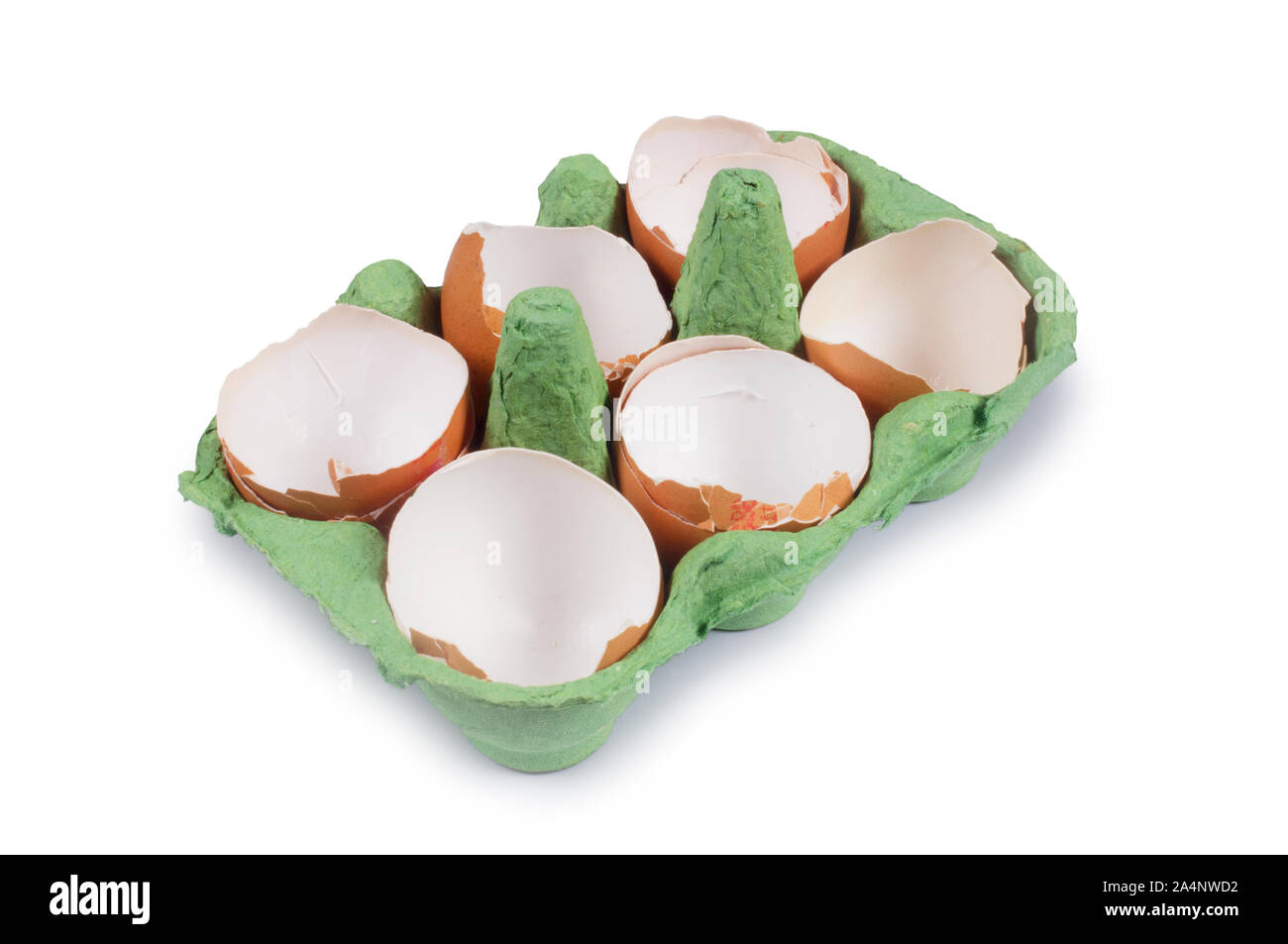 Studio shot of cracked egg shells in an egg box isolated on white ...