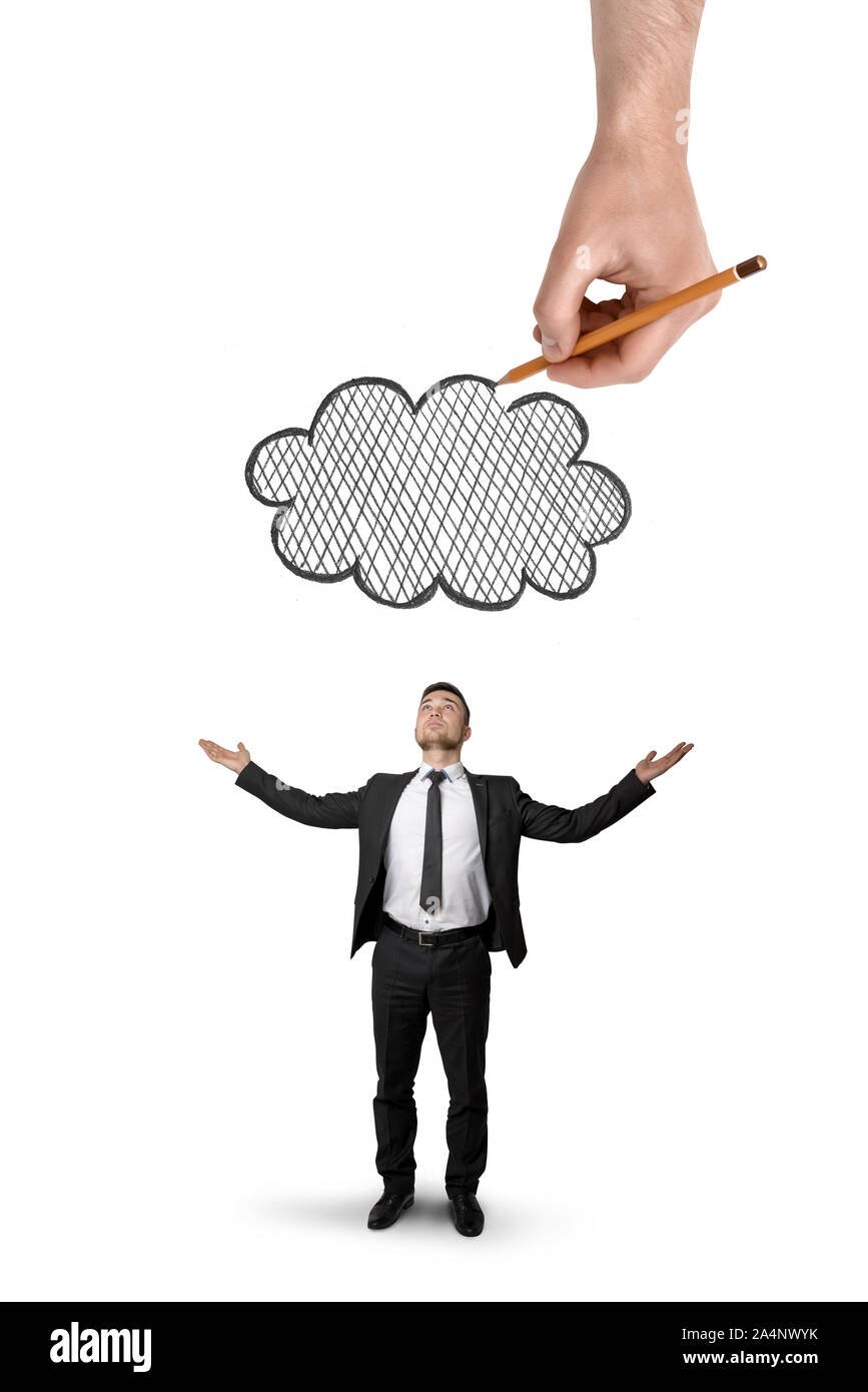 Businessman stands with raised hands and big hand above that draws ...
