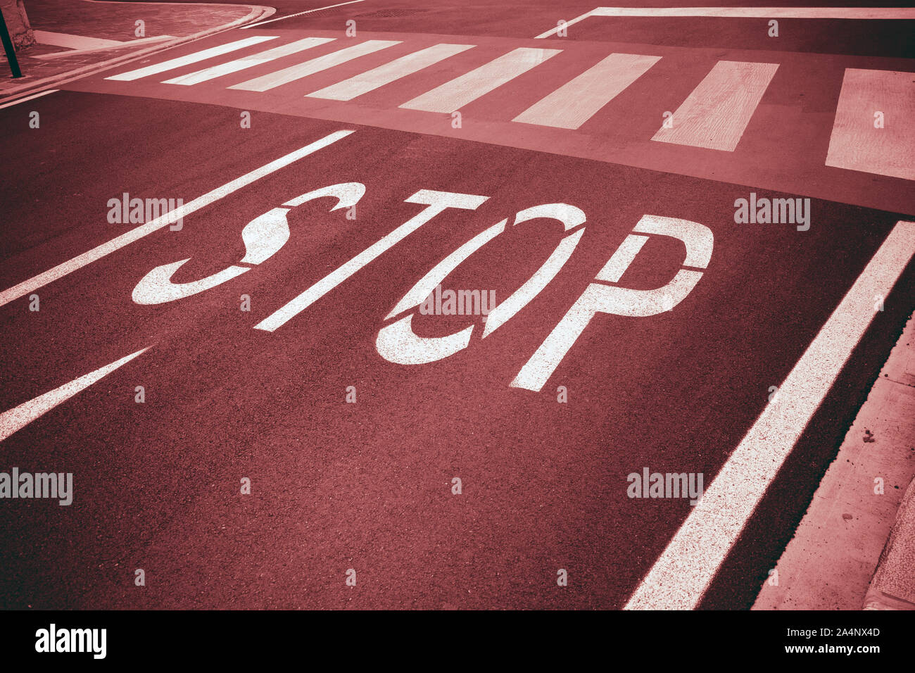 stop sign with pedestrian crossing, white paint on red street Stock ...