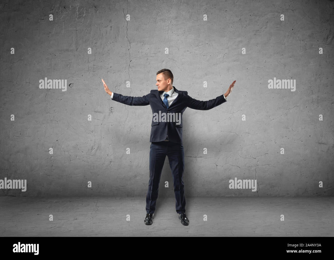 Cutout man pushing invisible walls. Faith in his own strength Stock ...