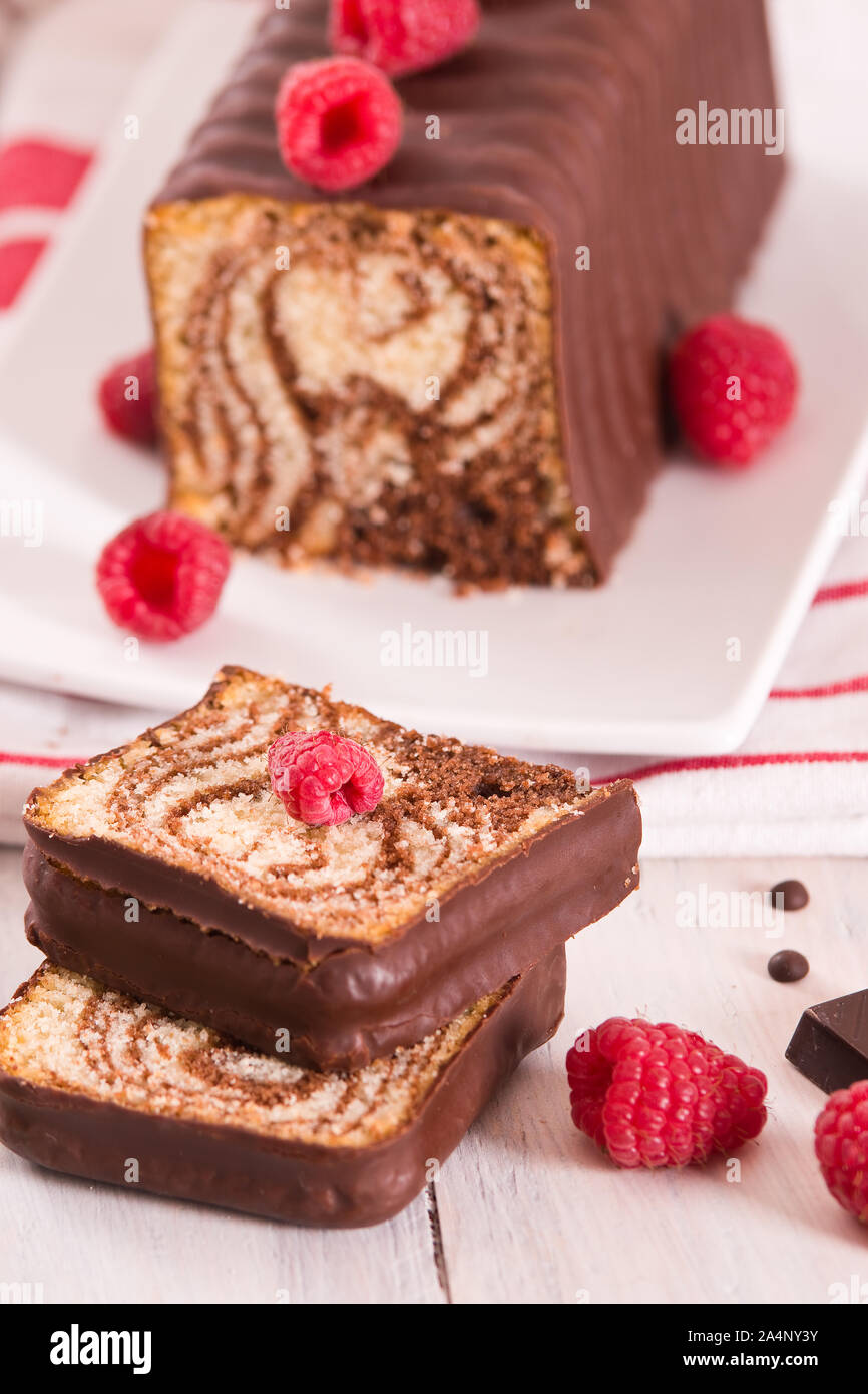 Marble cake with raspberries Stock Photo - Alamy