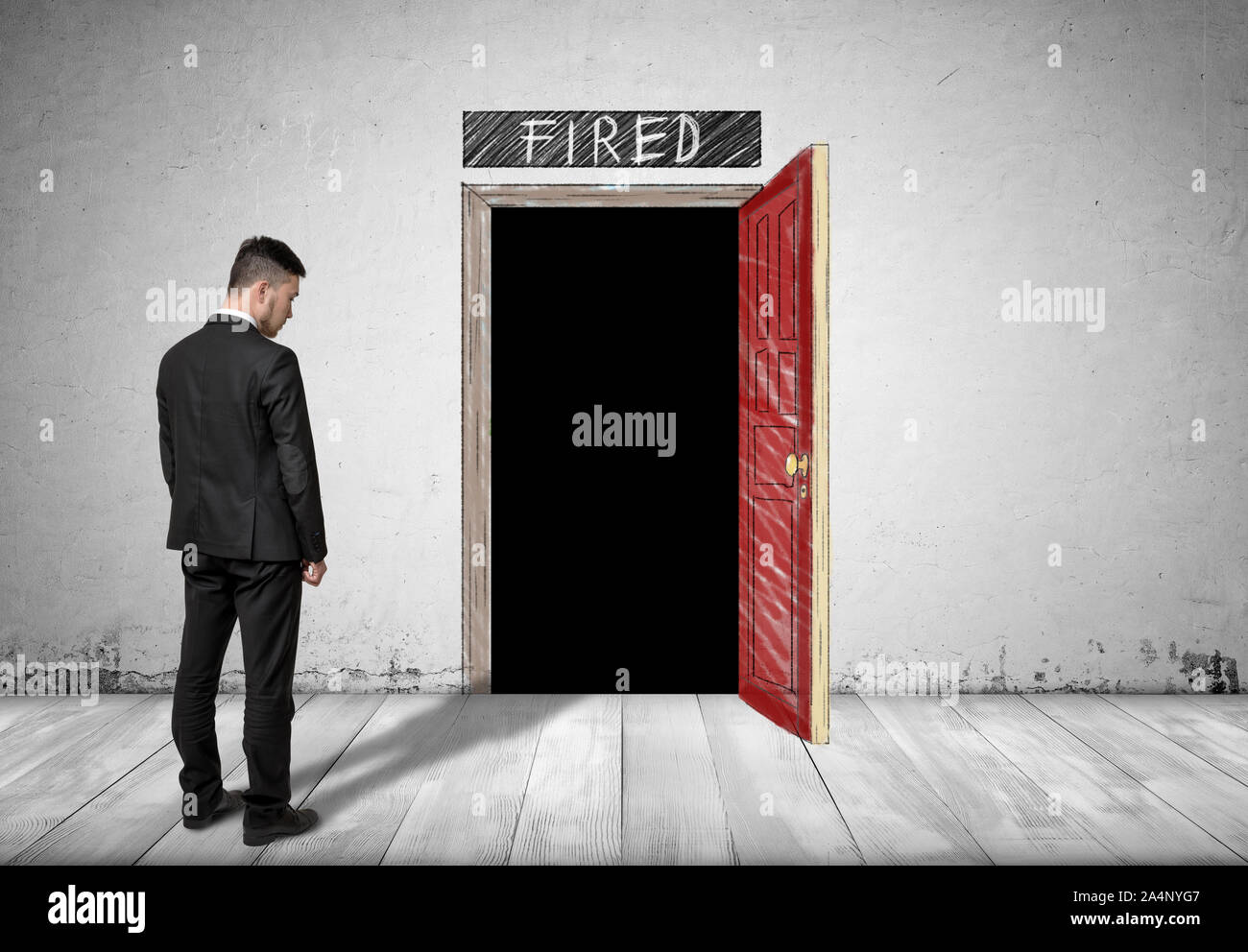 Businessman standing in front of an open door with darkness behind it ...