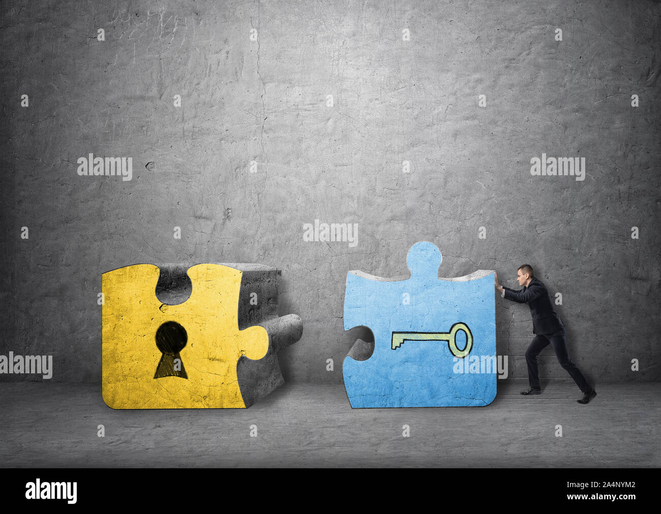 Businessman pulling together key and keyhole pieces of jigsaw puzzle ...