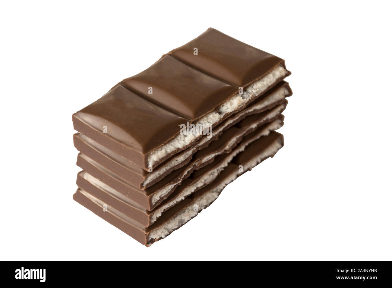 Stack of milk chocolate bar slices isolated on white background ...