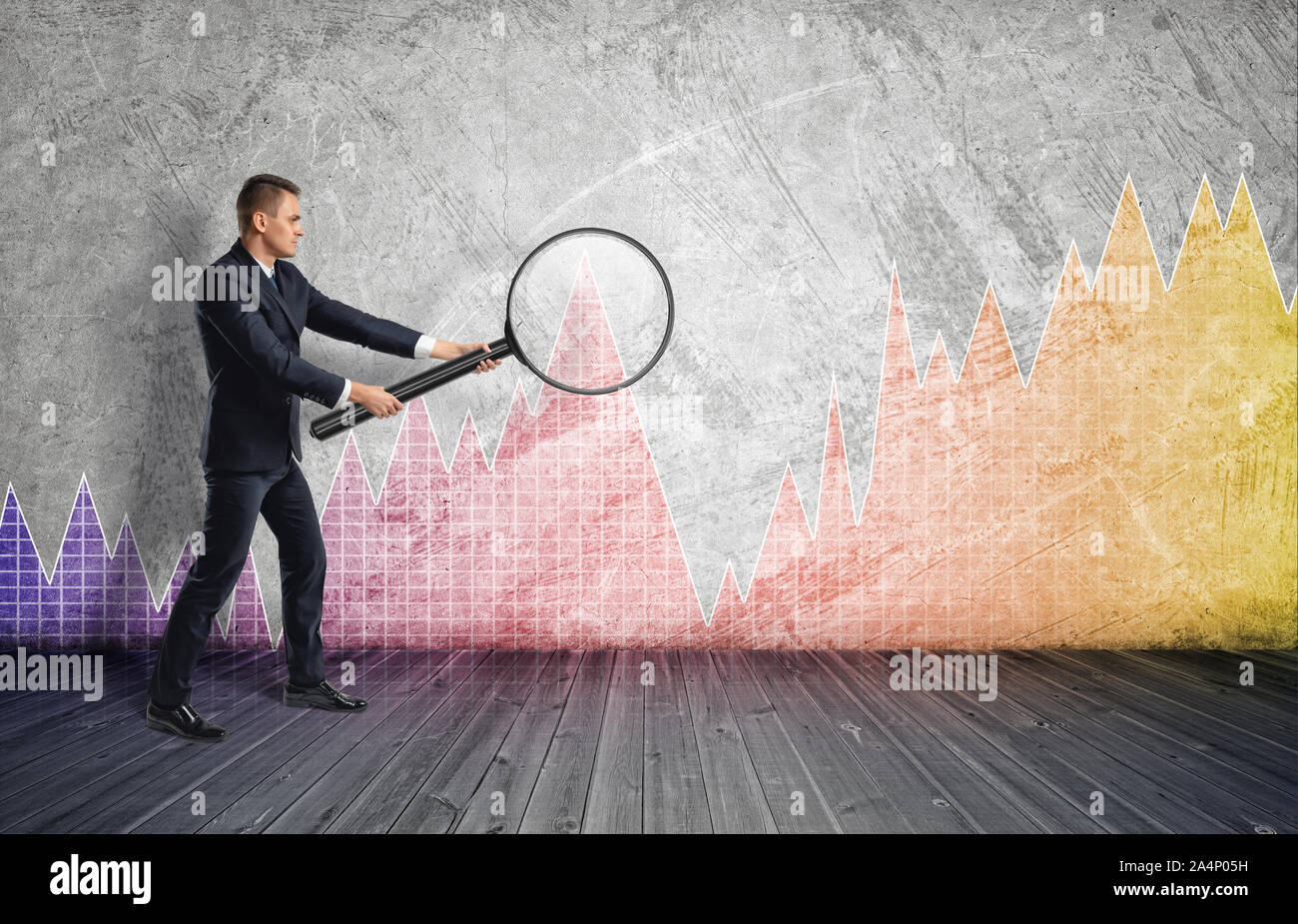 Businessman looking through a magnifier on colorful diagram Stock Photo ...