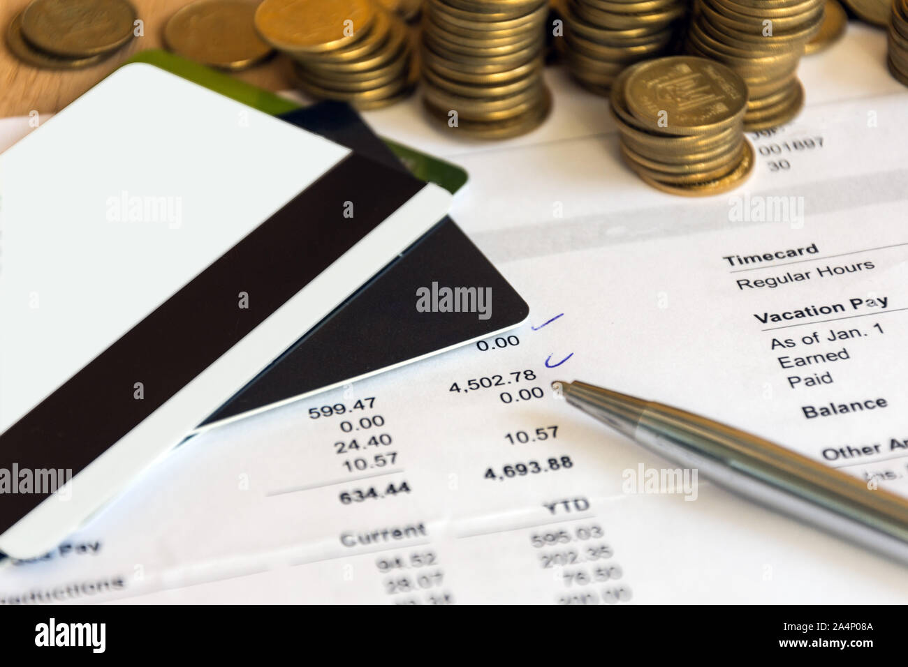 Paycheck, credit cards, coins top view. Finance accounting Stock Photo ...