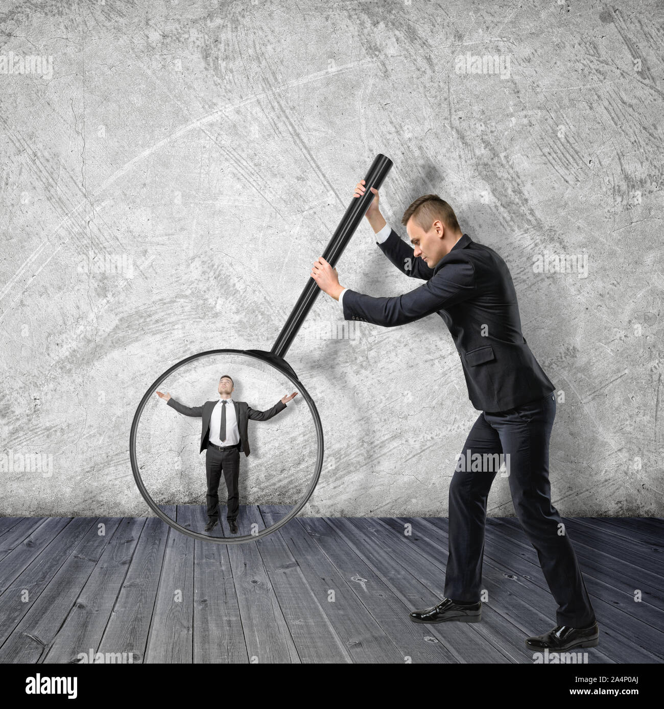 Big businessman enlarging small with magnifying glass Stock Photo - Alamy