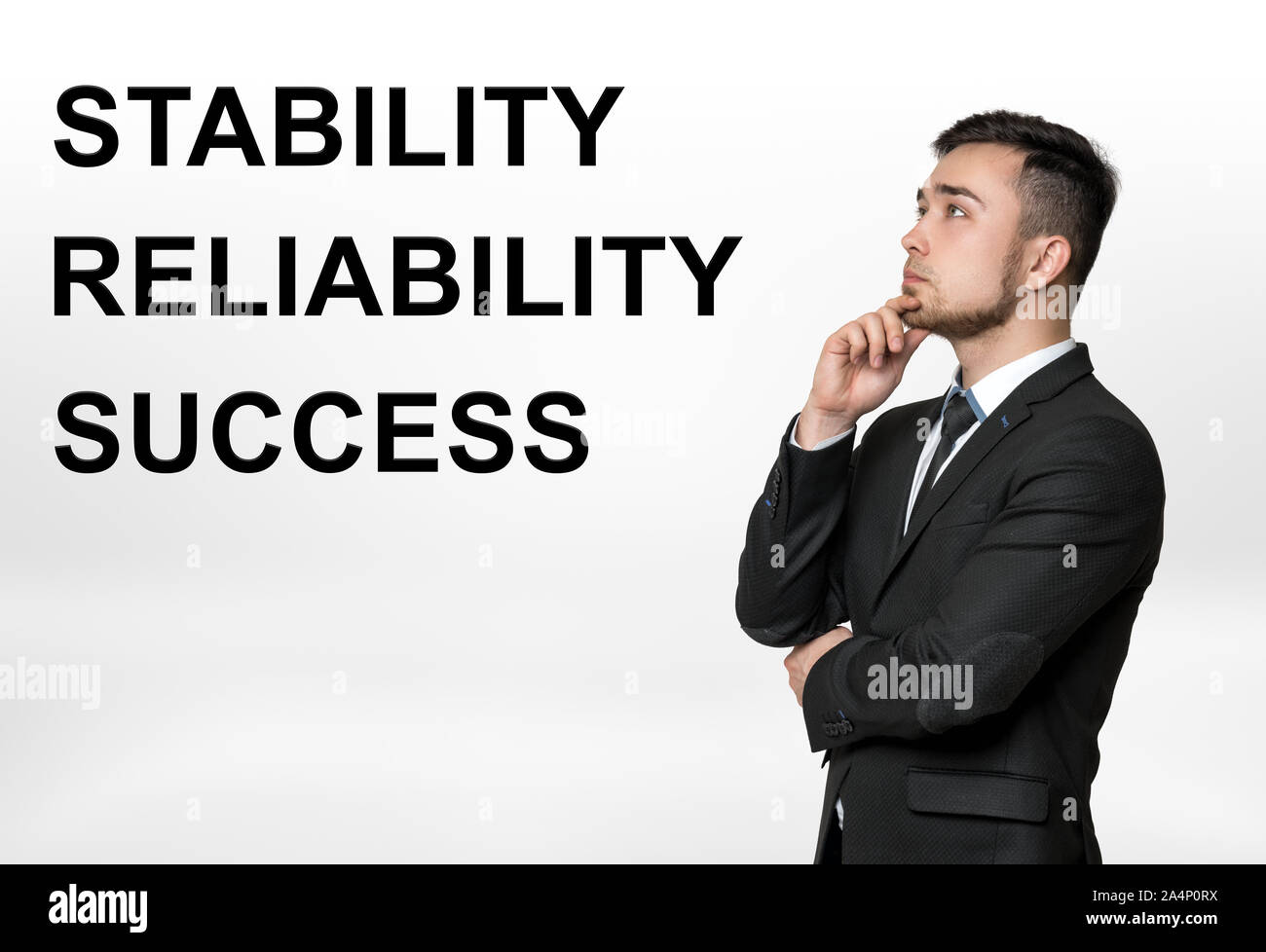 Cropped portrait of a businessman thinking with 'stability, reliability ...