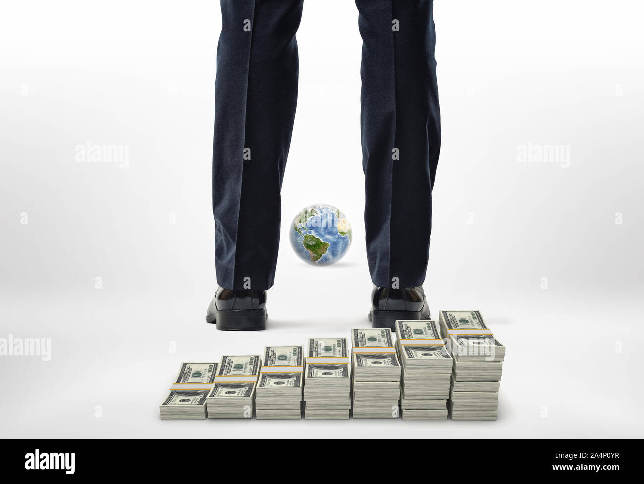 Close-up legs with packs of dollars and small globe Stock Photo - Alamy