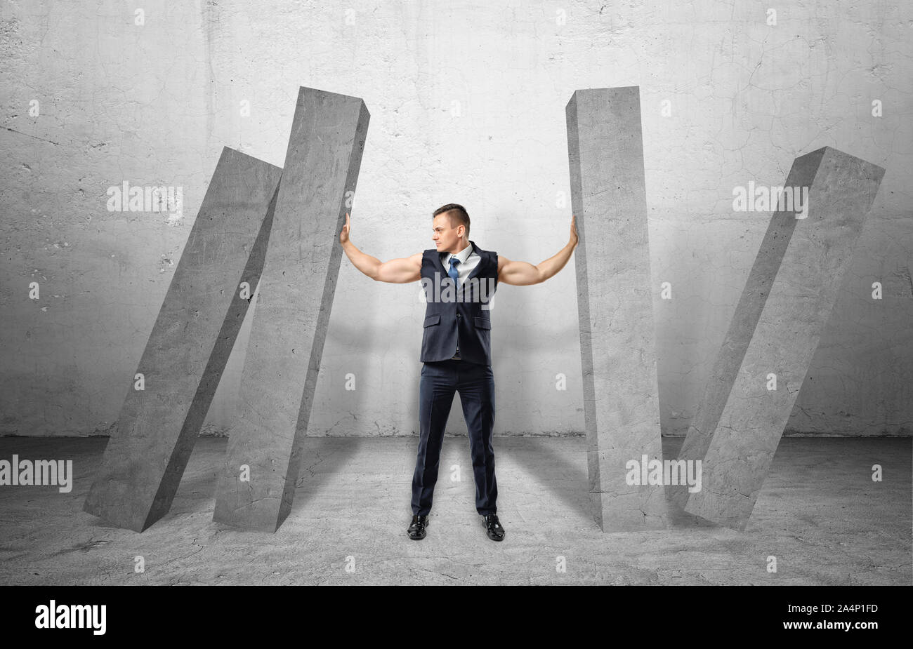 Muscular businessman full-height holding concrete four columns falling ...