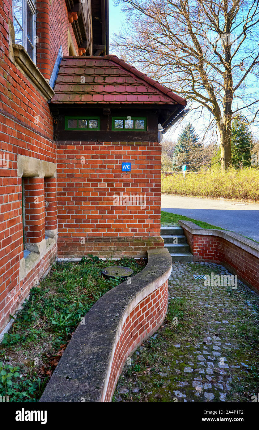 Old brick house as public toilet Stock Photo - Alamy