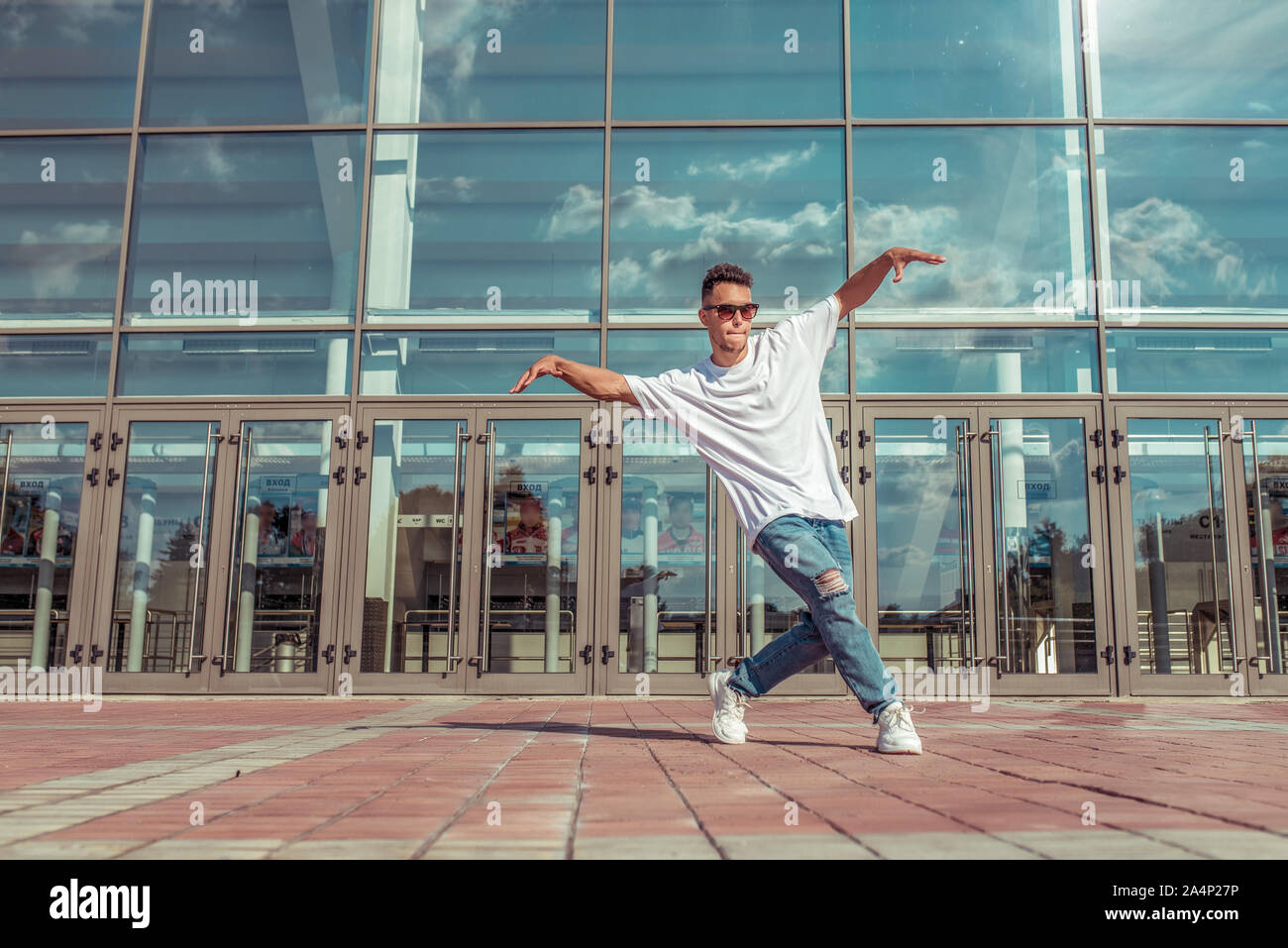 Dancer in motion dancing break dance, hip hop. In summer city ...