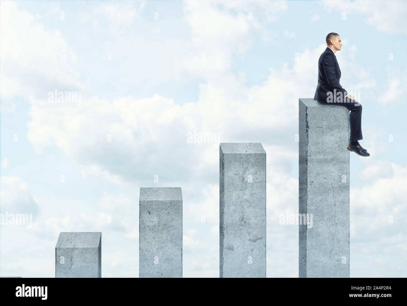 Businessman sitting on highest concrete columns of the chart Stock ...