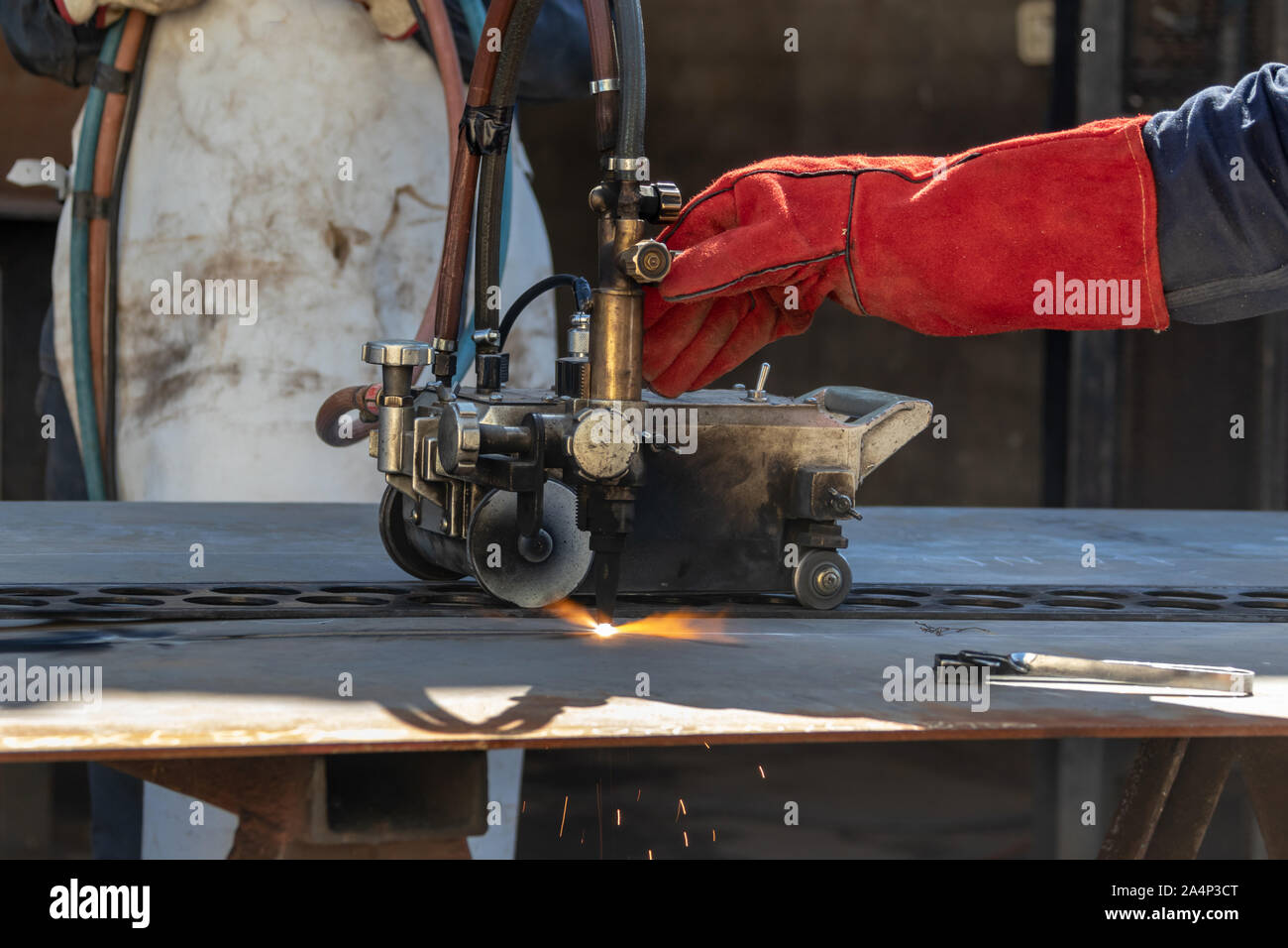 Motswana welder worker in a Botswana workshop, using an acetylene torch ...