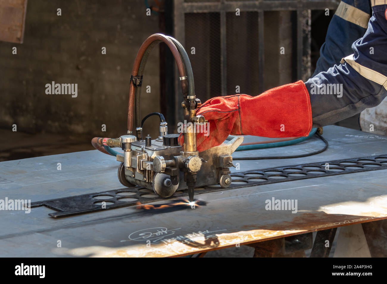 Motswana welder worker in a Botswana workshop, using an acetylene torch ...