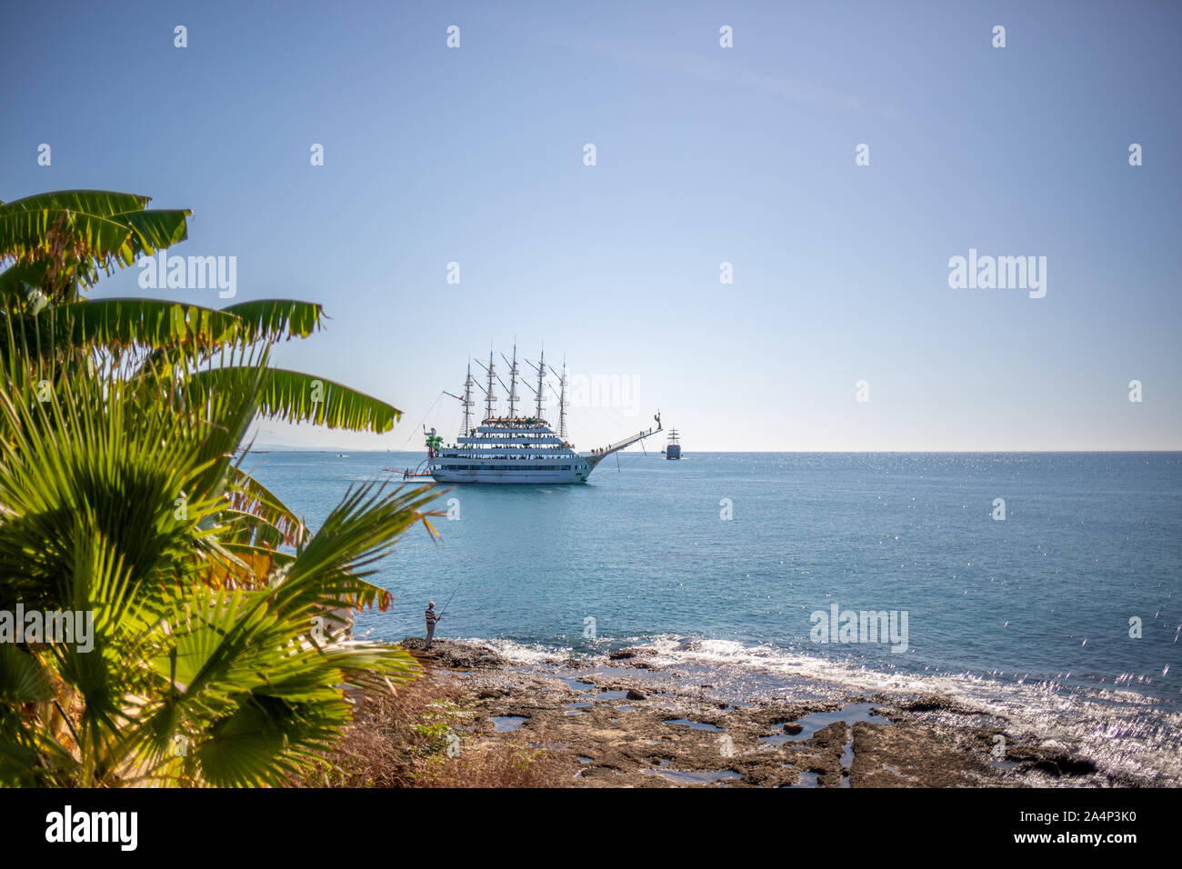 a sailing ship anchors in the port of Side in fine weather Stock Photo ...